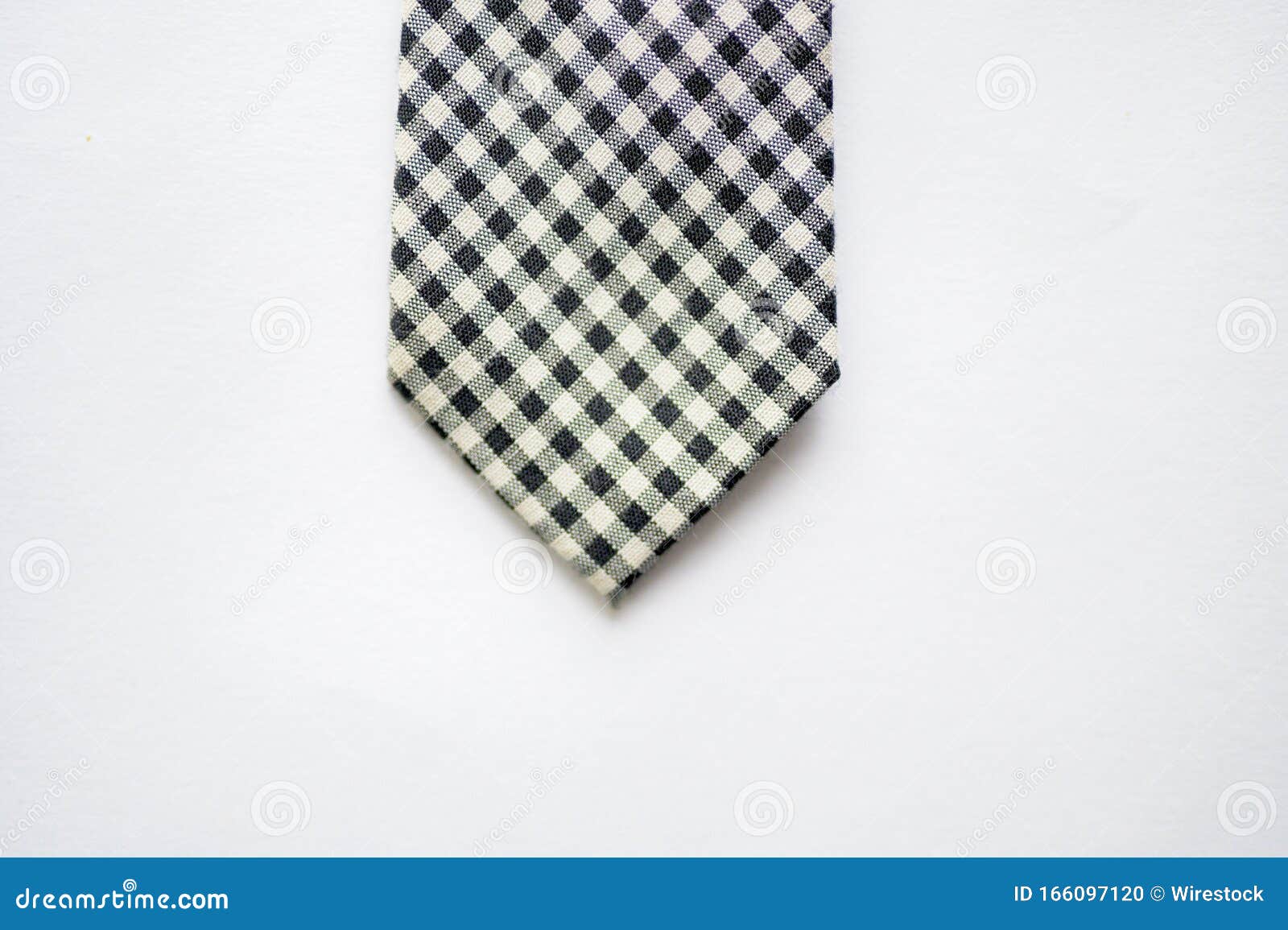 Overhead Shot of a White and Black Tie on a White Surface Stock Photo ...