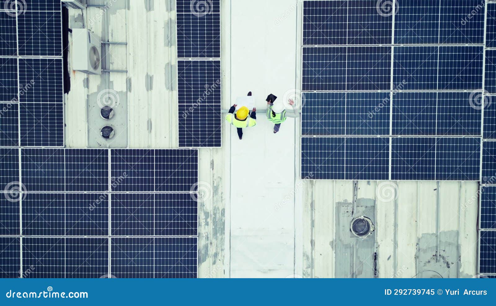 Overhead, Solar Energy and a Construction Worker Team on the Roof of a ...
