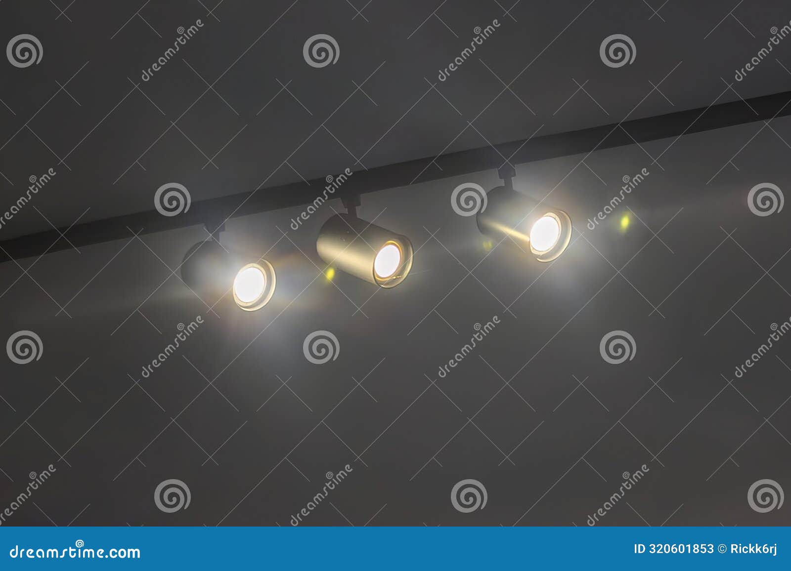 Overhead Track Lighting Installation with Artistic Glare Stock Image ...