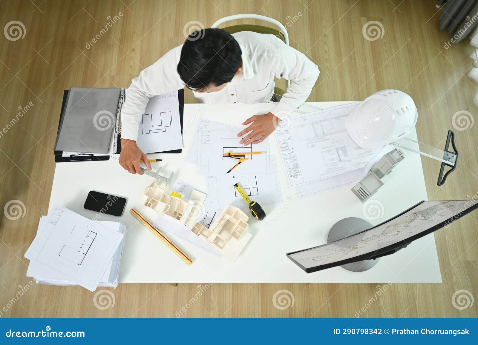 Overhead View of Architect Man Examining House Model while Working ...