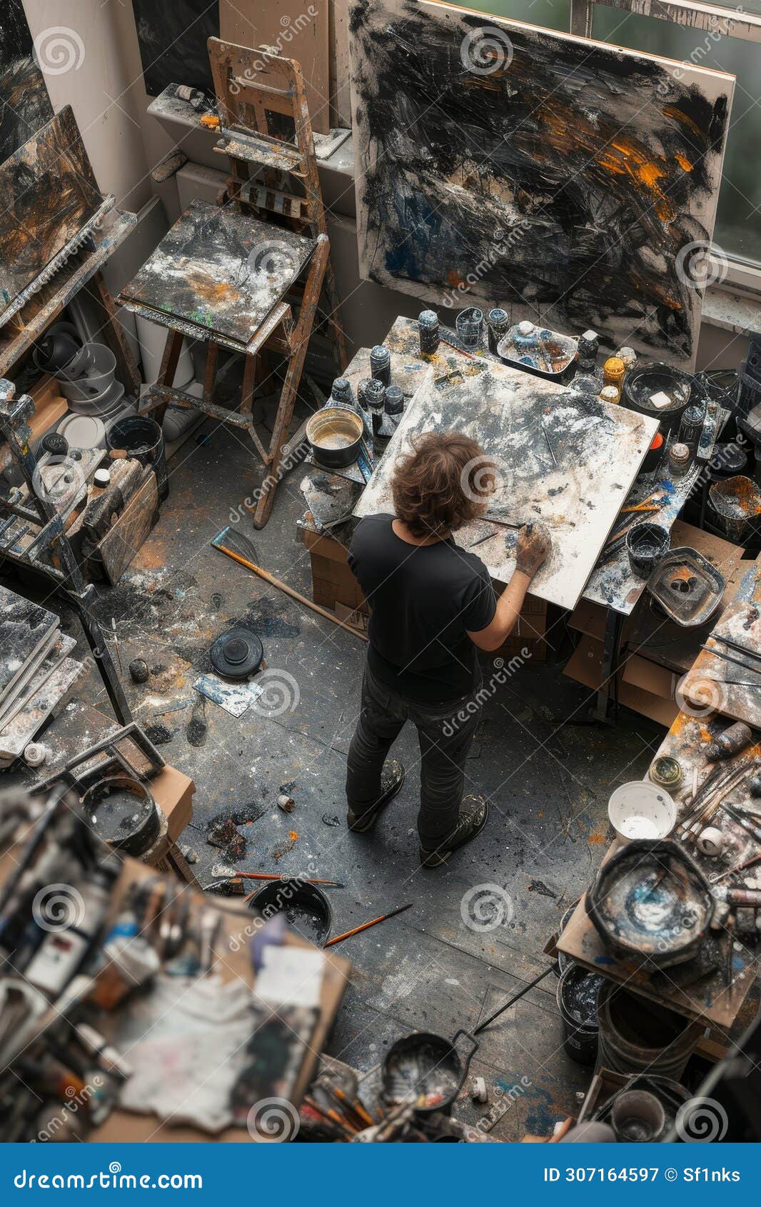 Overhead View of an Artist at Work on a Large Abstract Canvas in a ...