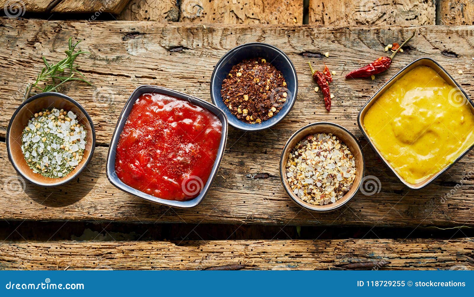 Assorted Condiments And Spices On A Picnic Table Stock Photo ...