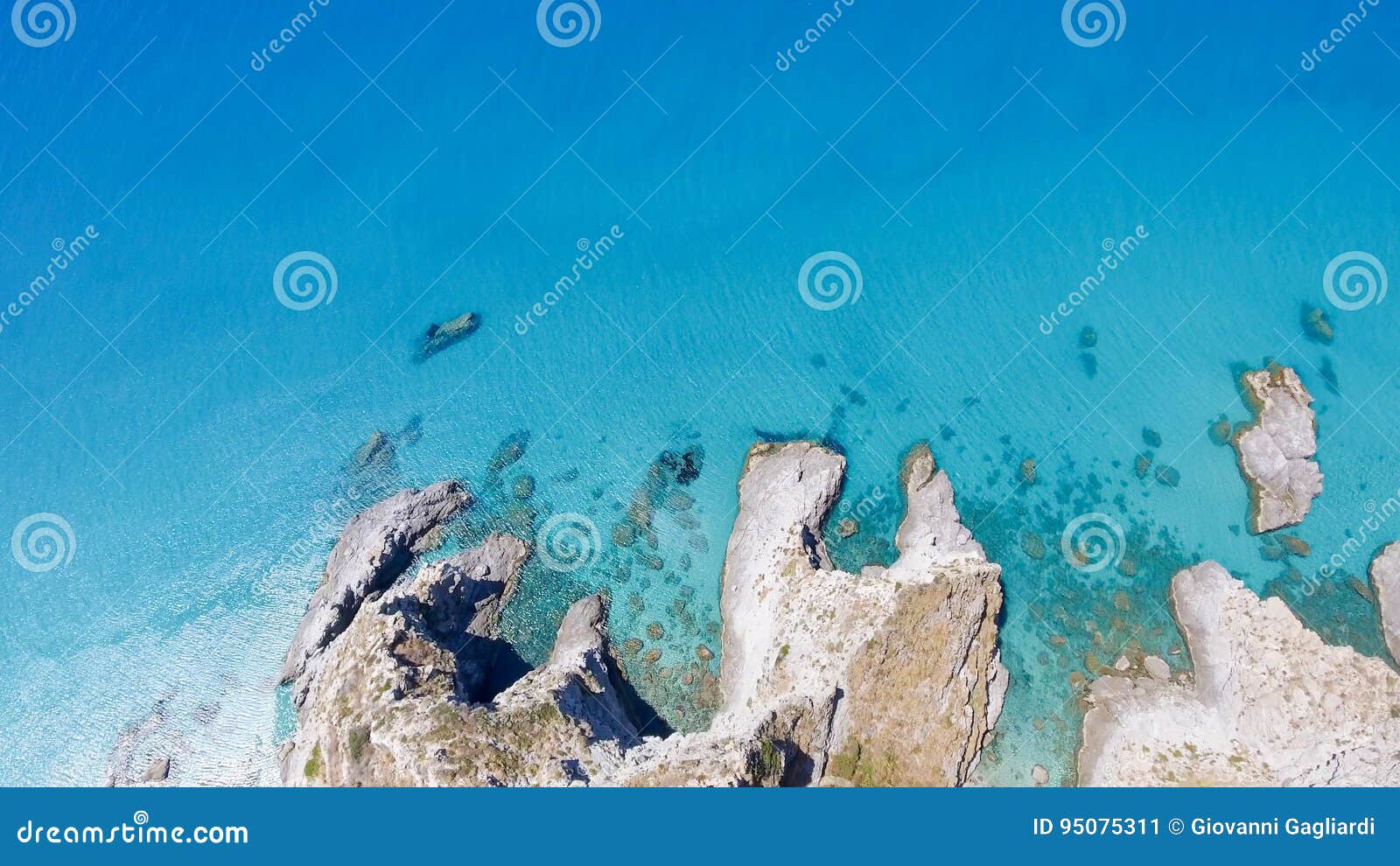 Overhead View of Beautiful Rocks Over Crystal Clear Ocean Stock Image ...