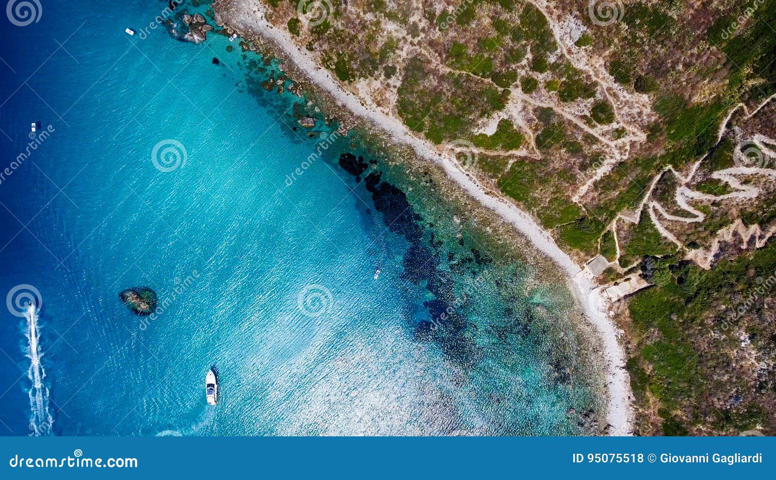 Overhead View of Beautiful Rocks Over Crystal Clear Ocean Stock Photo ...