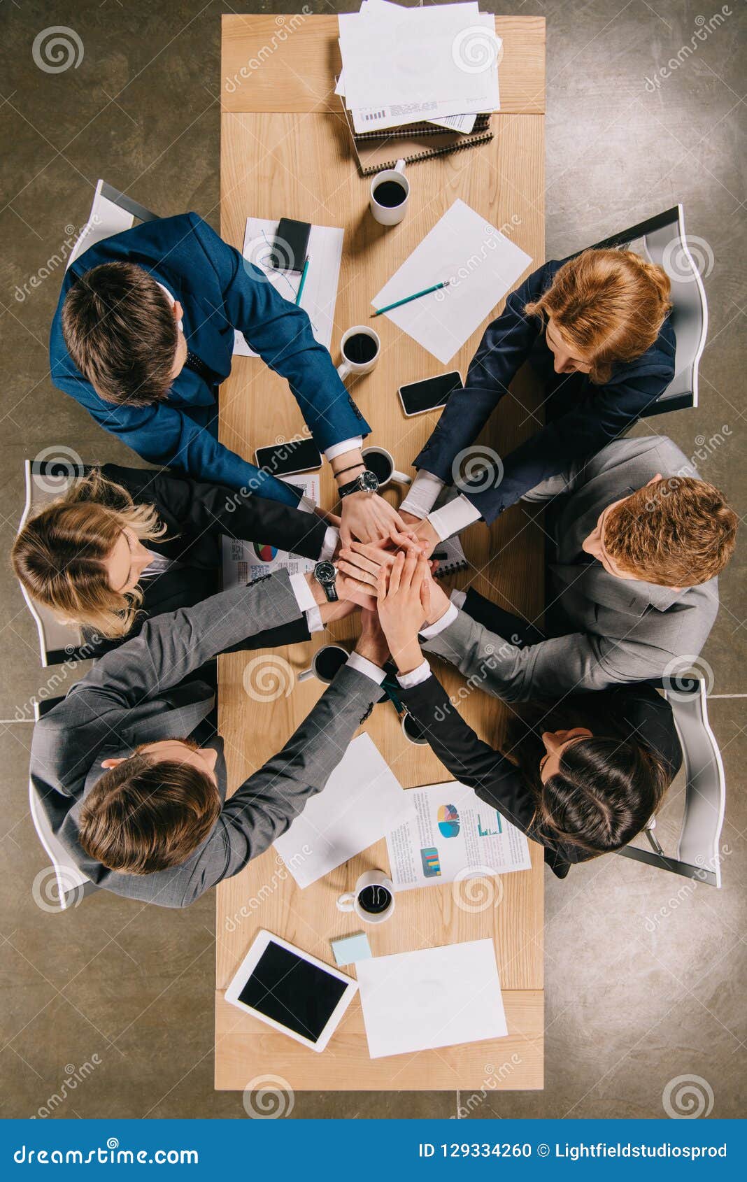 Overhead View of Business Partners at Table in Office Businesspeople ...