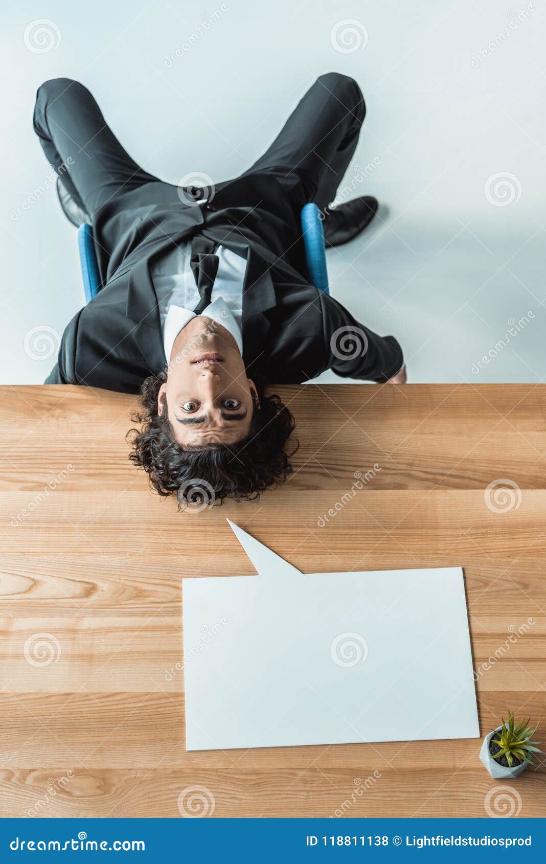 Overhead View of Businessman Lying on Table with Empty Stock Photo ...