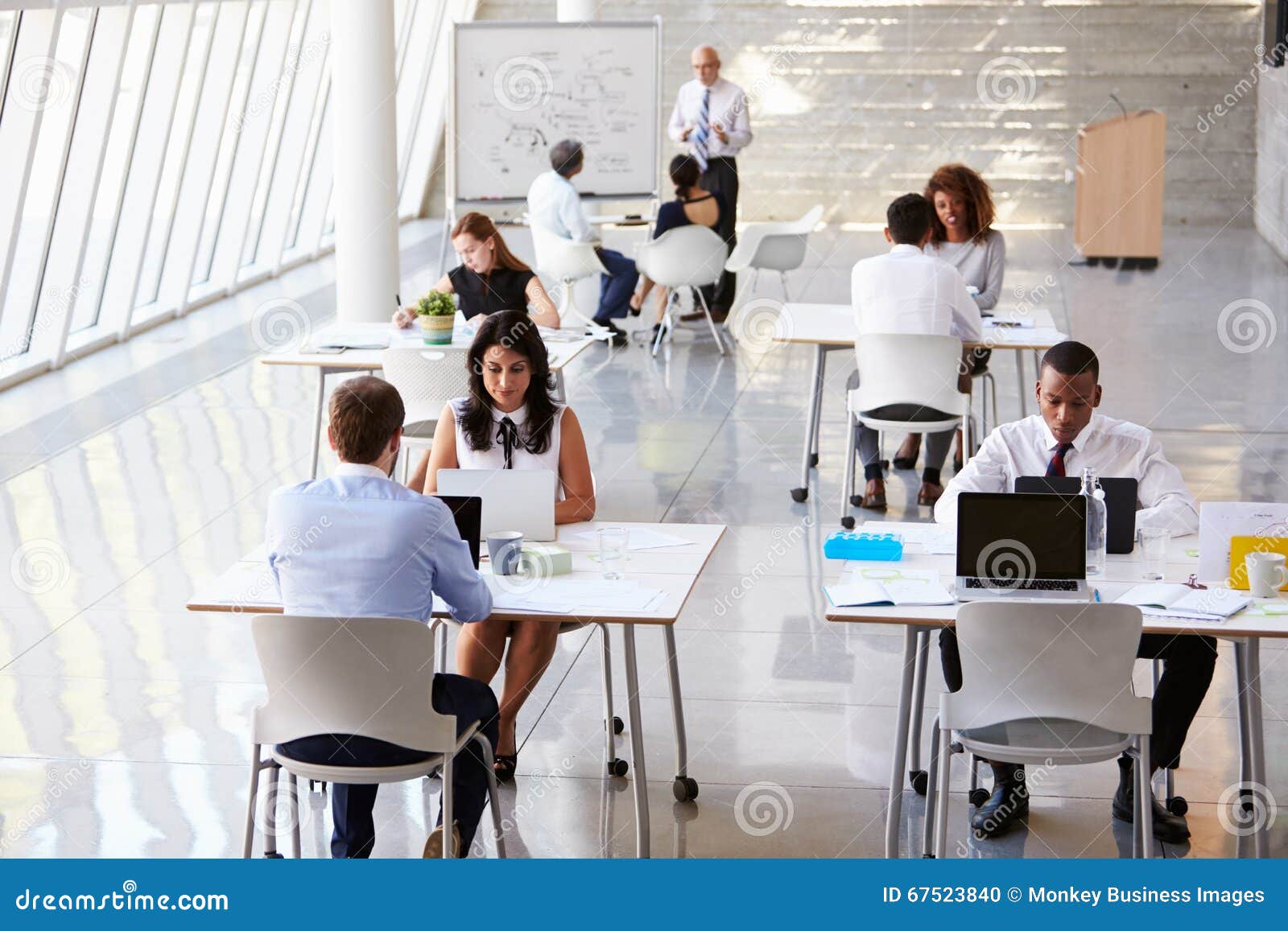 Overhead View of Businesspeople Working at Desks in Office Stock Photo ...