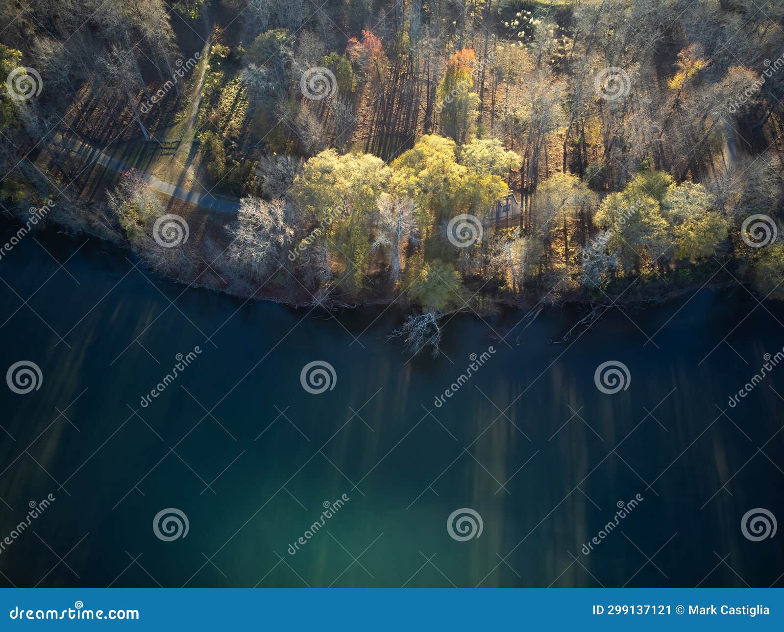 Overhead View of Curved Riverbank with Footpath and Long Shadows Stock ...