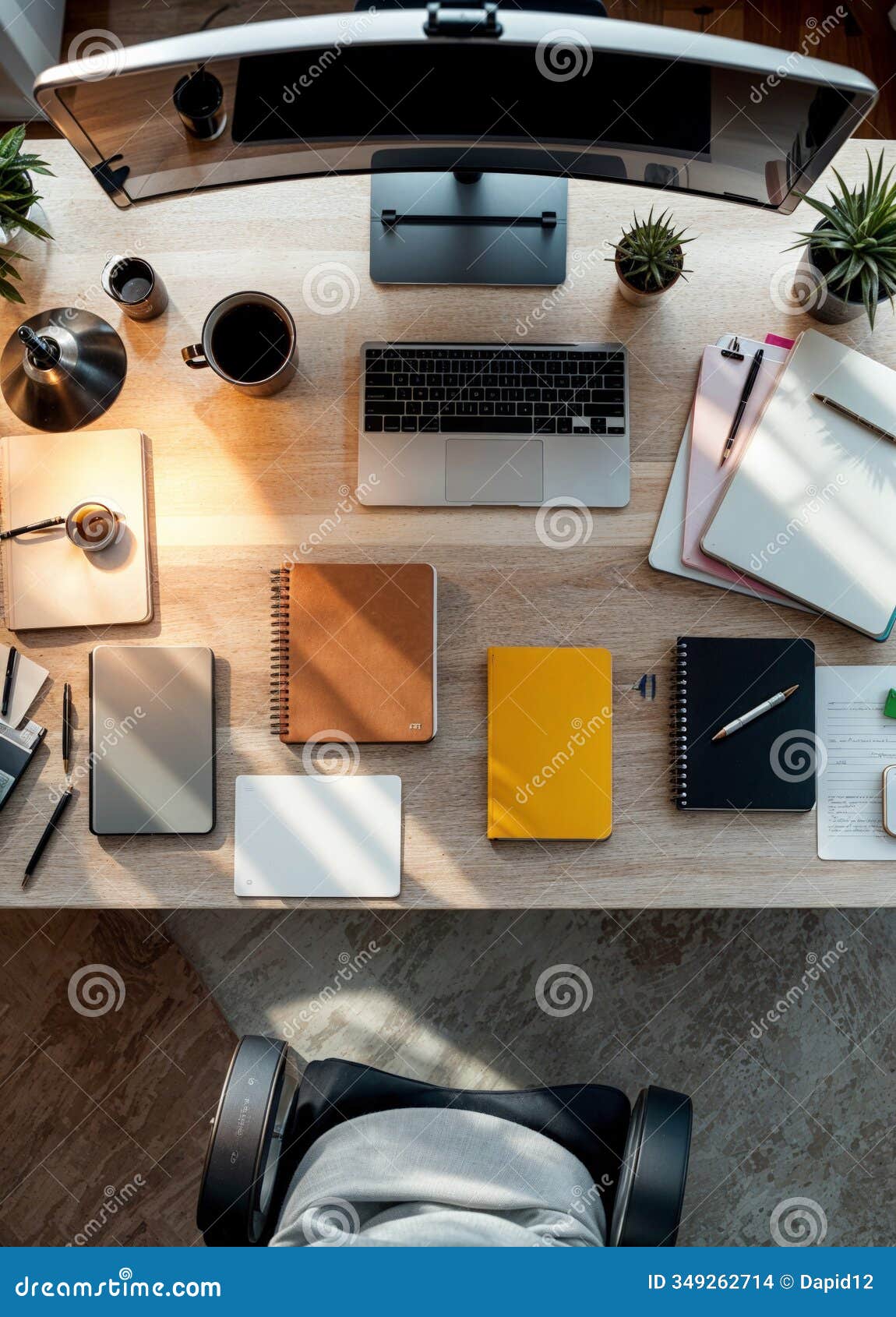 An Overhead View of a Desk with a Computer, Laptop, and Other Business ...