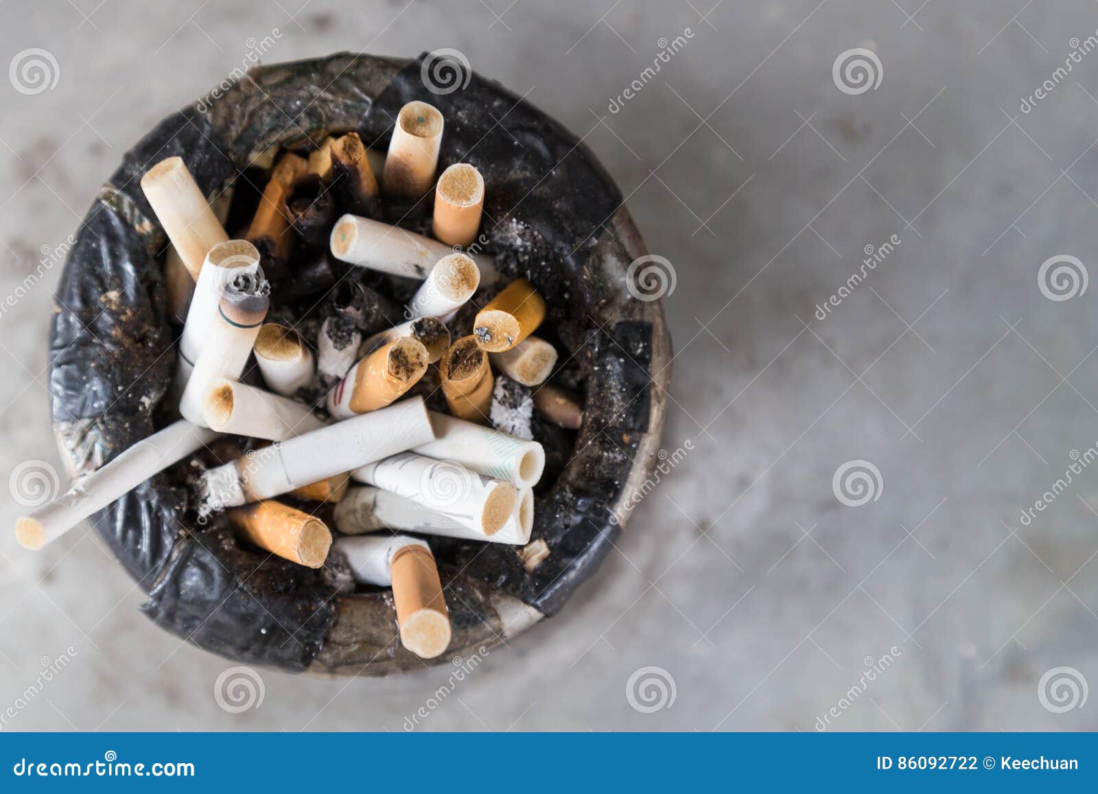 Overhead View of Dirty Cigarette Butts in Ash Tray Stock Photo - Image ...