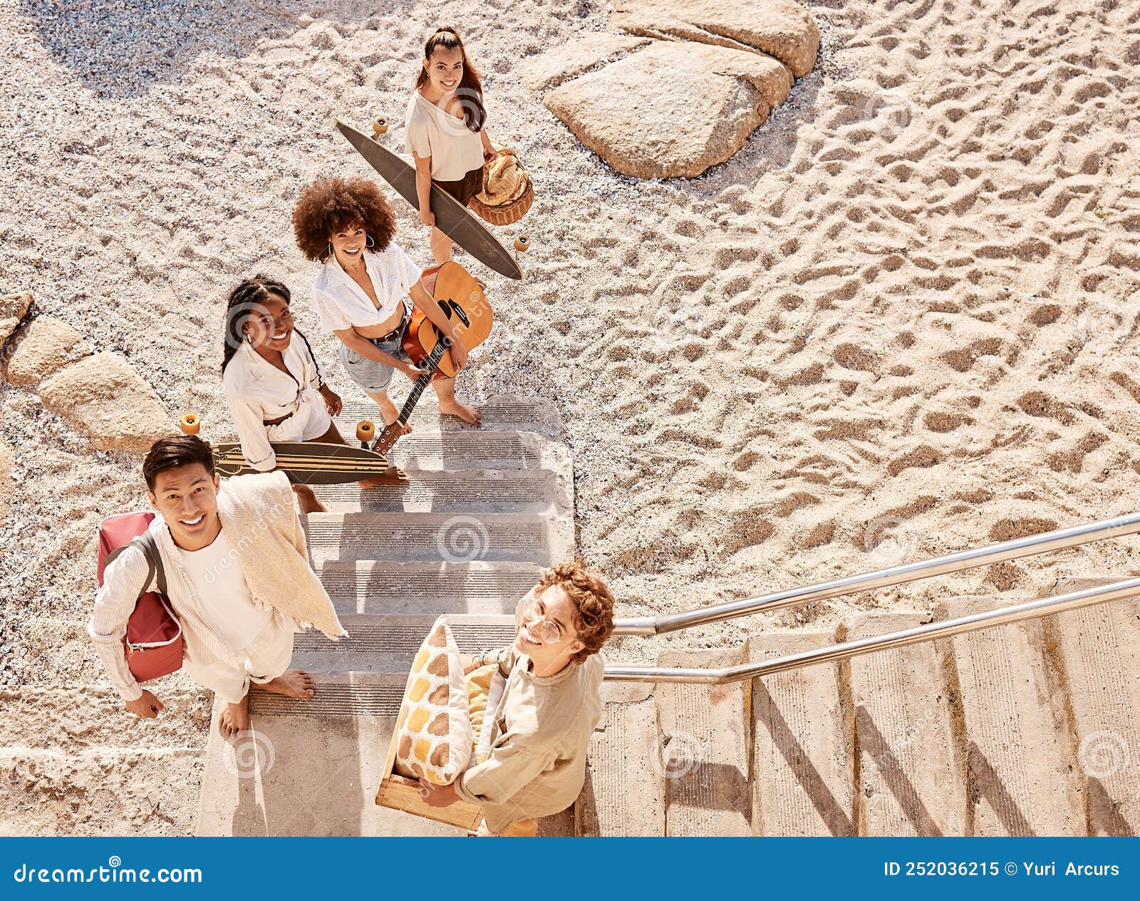 A Overhead View Of A Diverse Group Of Friends At The Beach For A Picnic