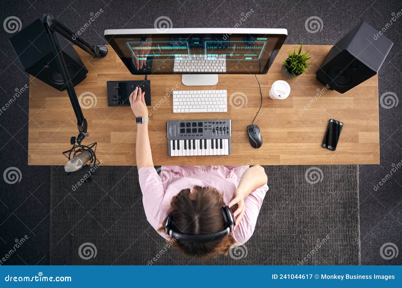 Overhead View of Female Musician at Workstation with Keyboard and ...