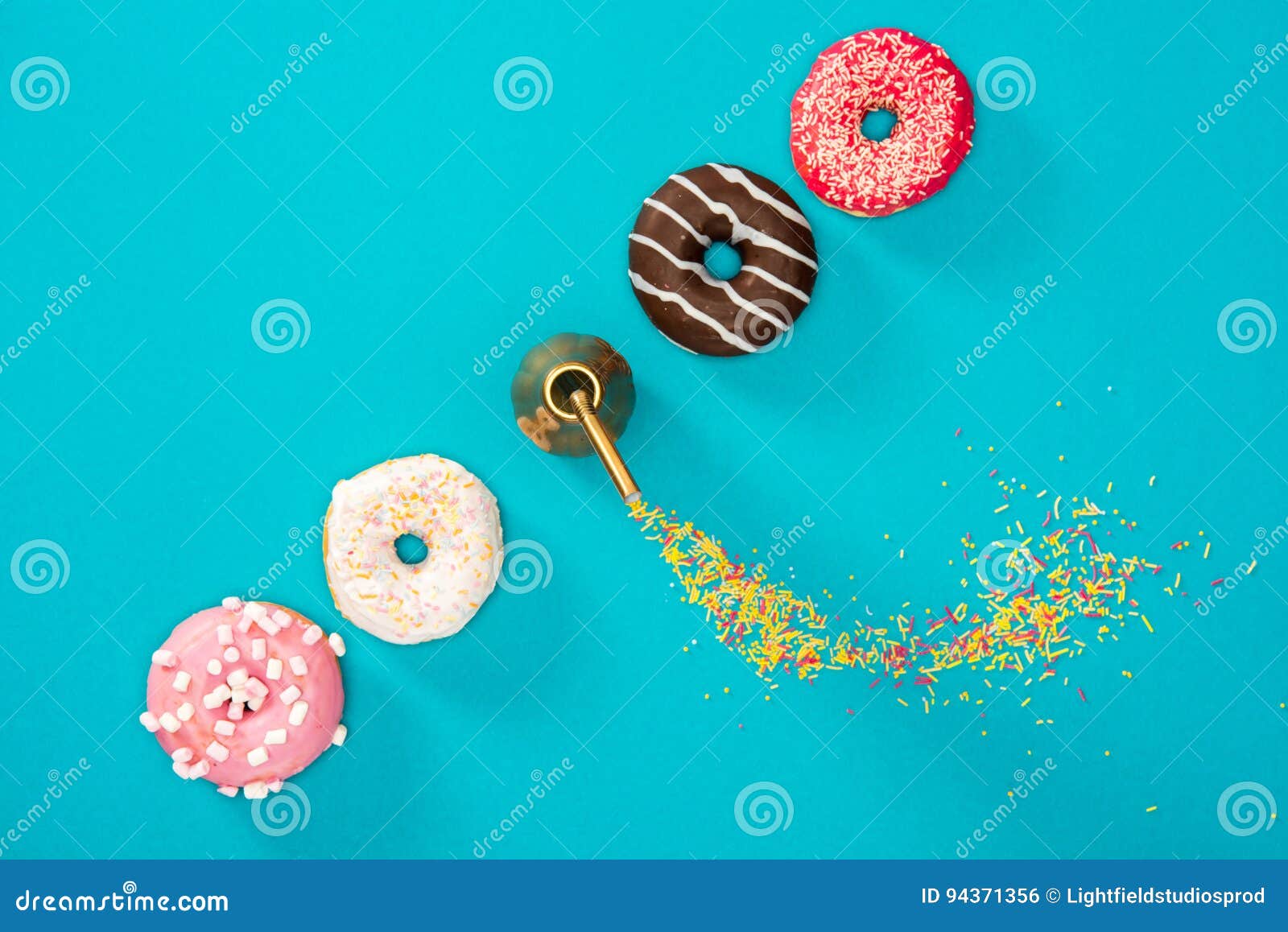 Overhead View of Four Donuts with Colorful Glaze in Row. Donuts Stock ...
