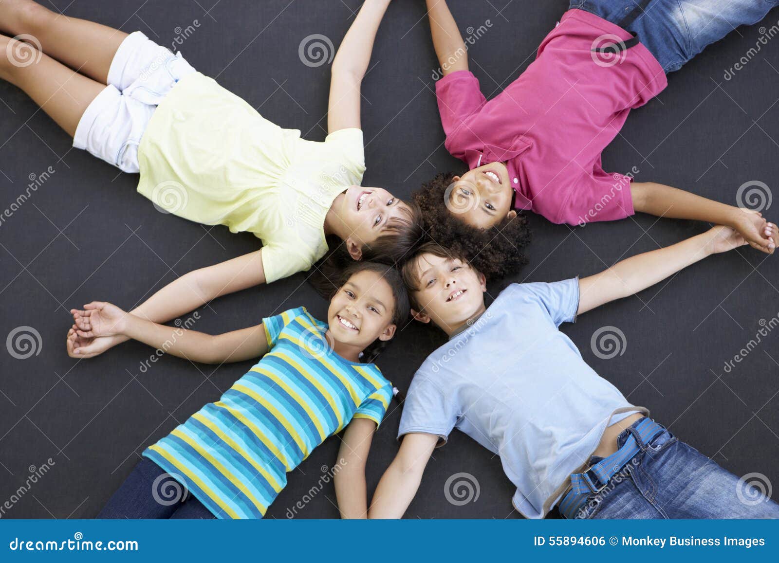 Overhead View of Group of Children Lying on Trampoline Together Stock ...