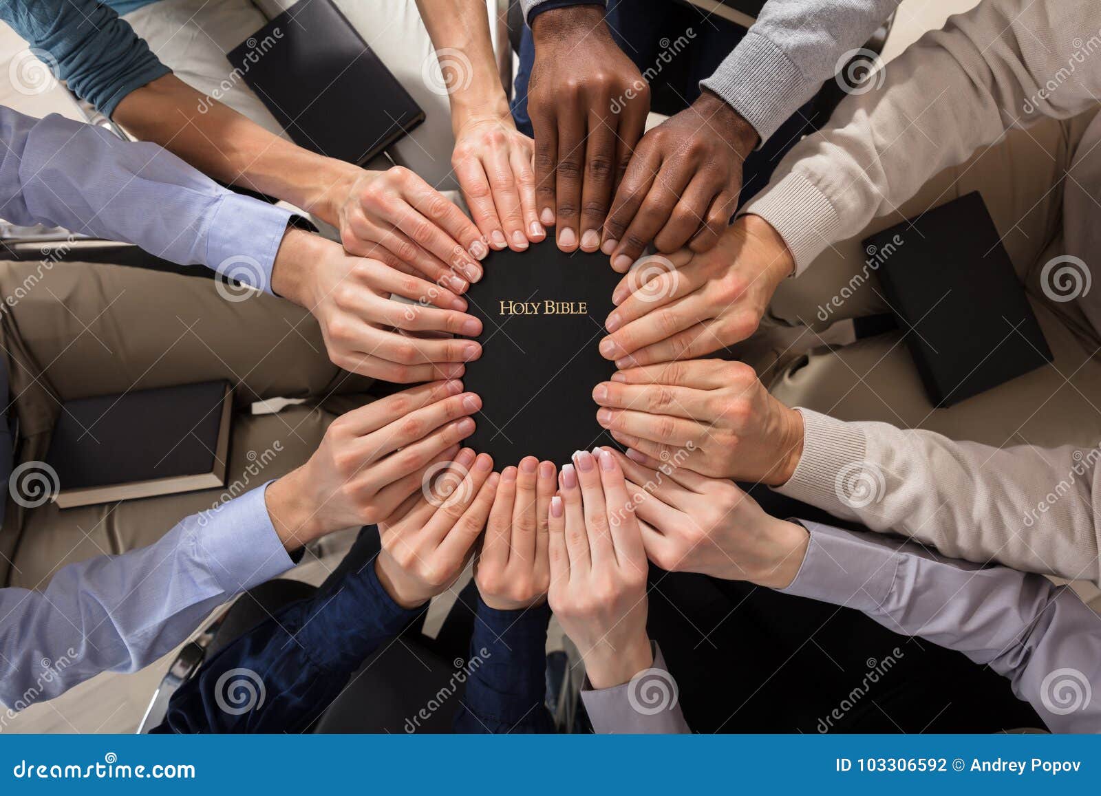 Hands Holding Holy Bible stock photo. Image of group - 103306592