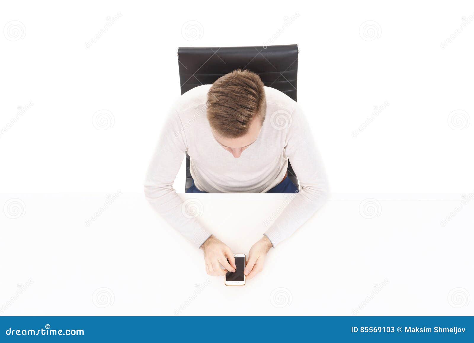 Overhead View of a Handsome Guy with Smartphone in Office. Business and ...