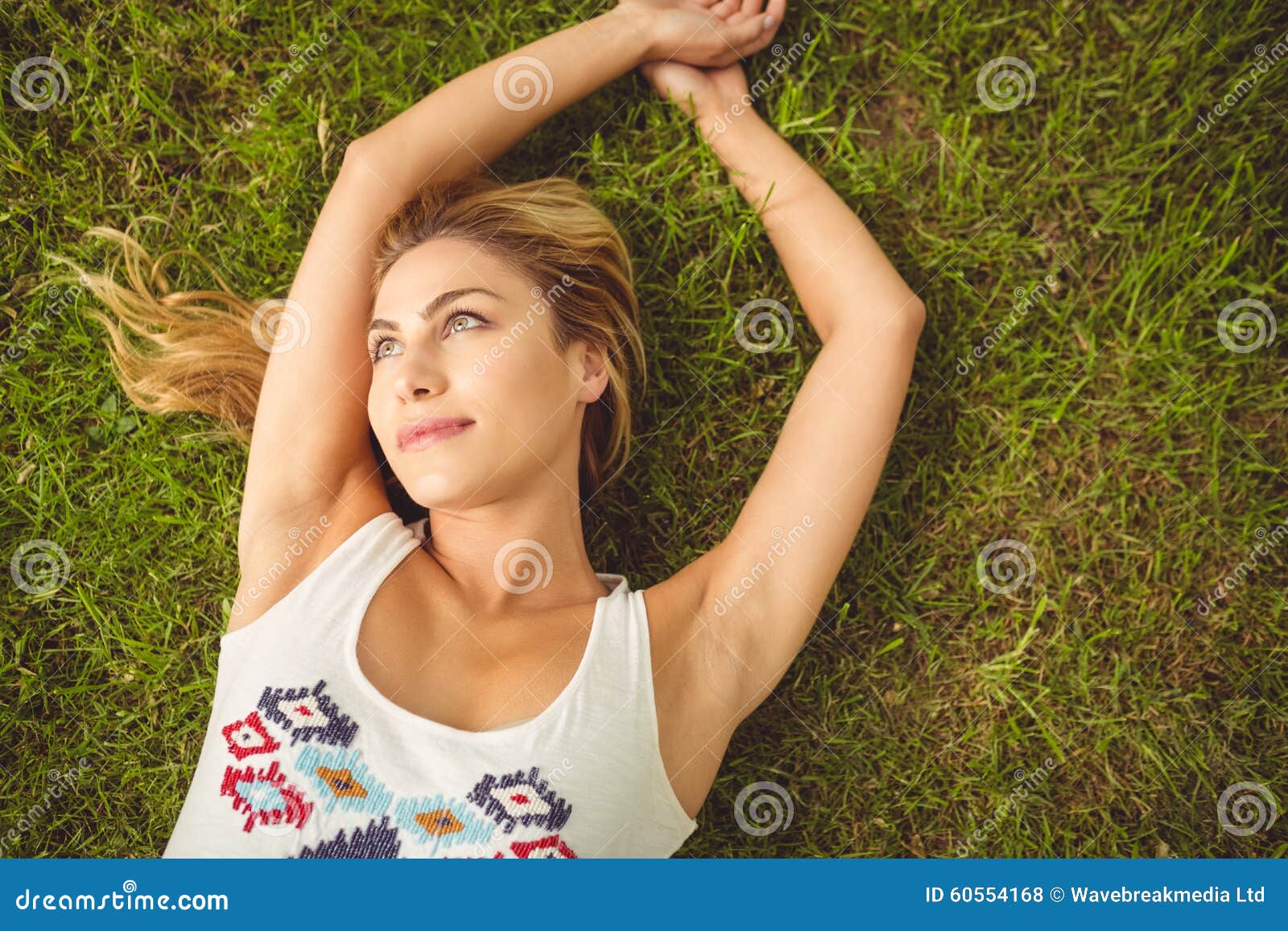 Overhead View of Happy Woman Lying on Grass Stock Photo - Image of ...