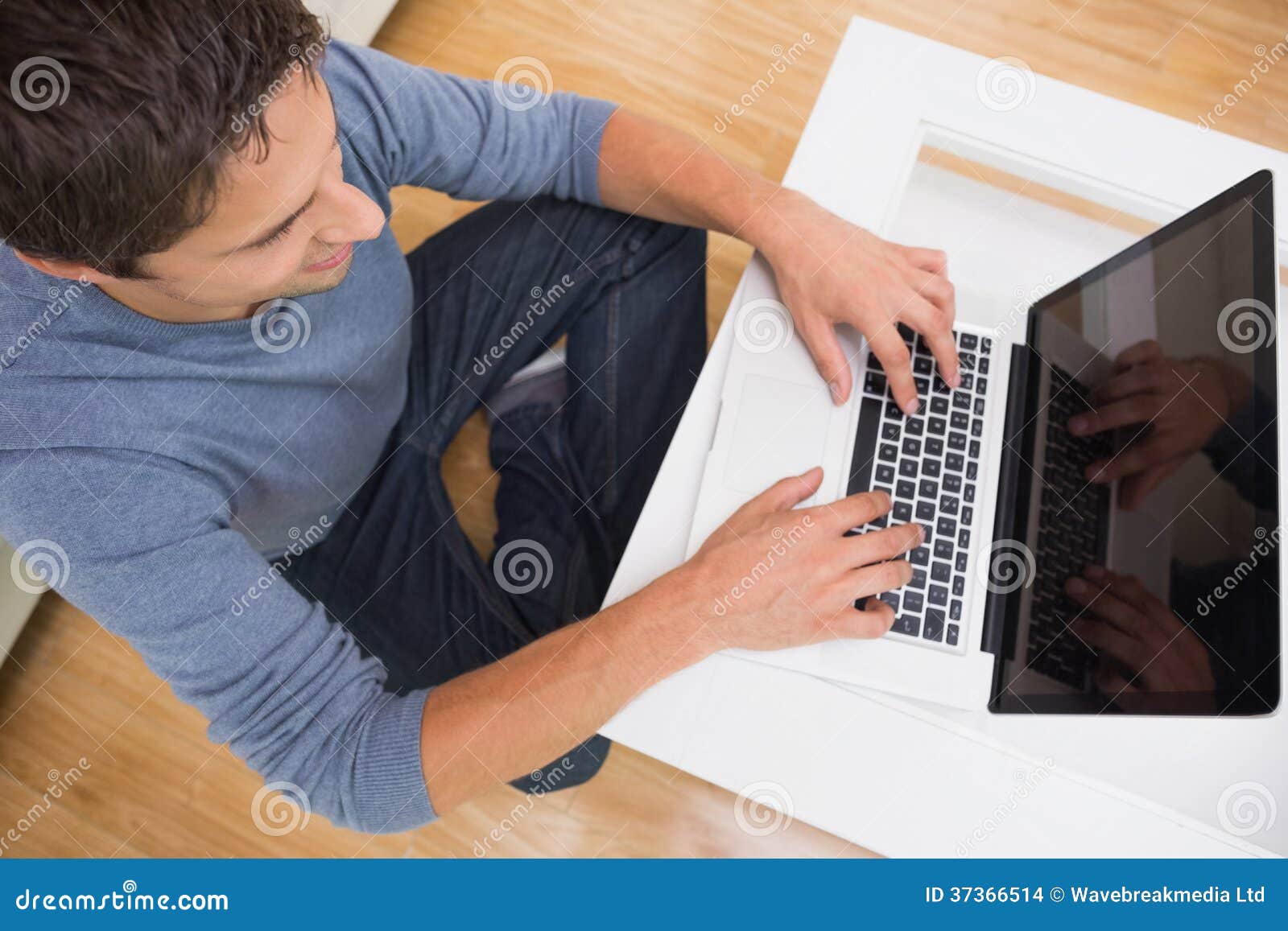 Overhead View of a Man Using Laptop in Living Room Stock Photo - Image ...