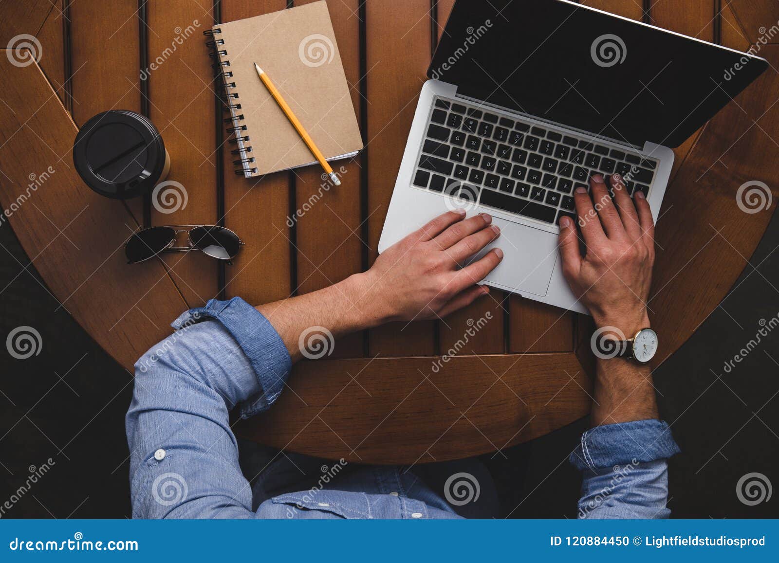 Overhead View of Man Using Laptop while Sitting at Table with Coffee ...