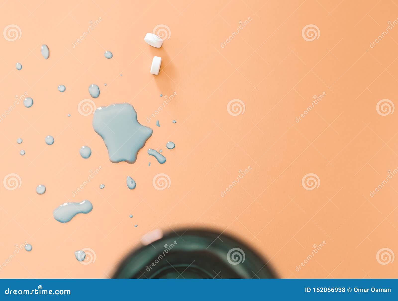 Overhead View of Medication Tablets on Pastel Orange Surface with Water ...