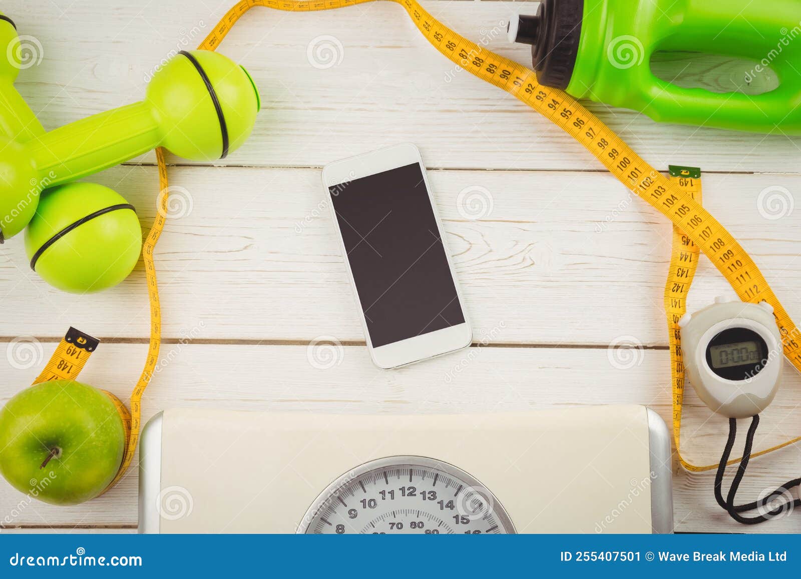 Overhead View of Mobile Phone and Tape Measure on Table Stock Image ...