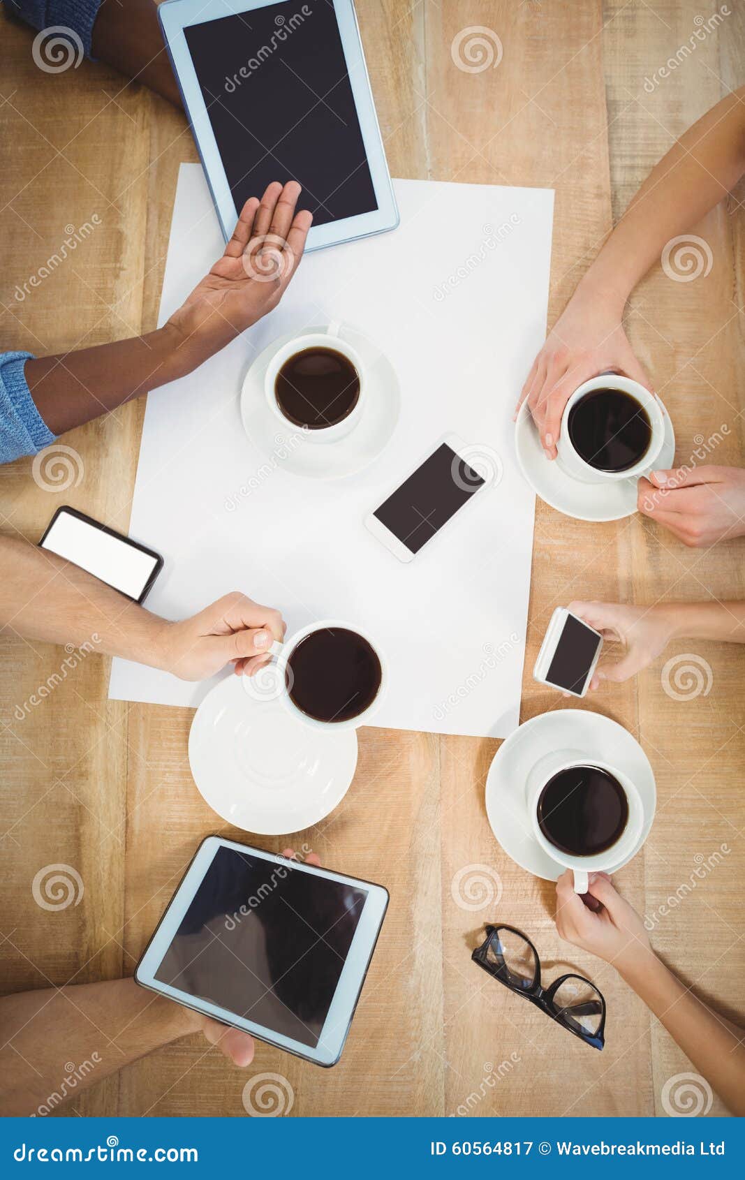 Overhead View of People Using Technology with Person Showing Digital ...