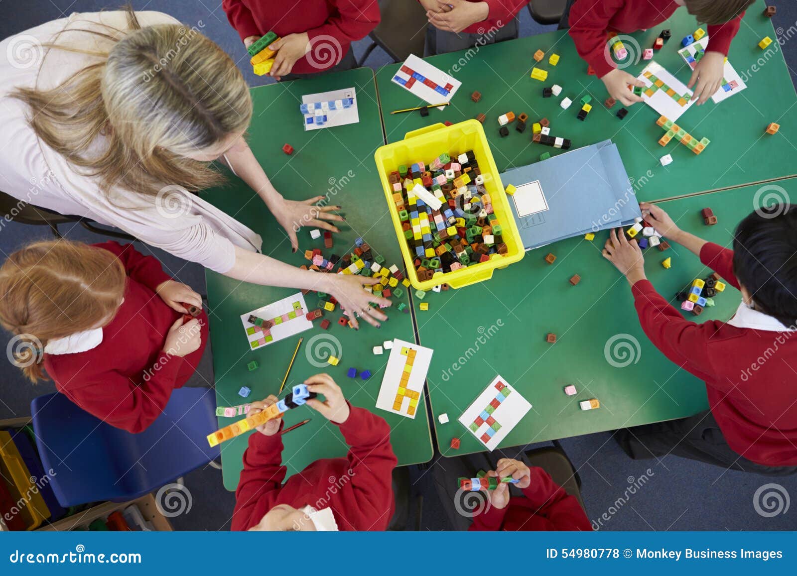 Overhead View of Pupils and Teacher Working with Blocks Stock Photo ...