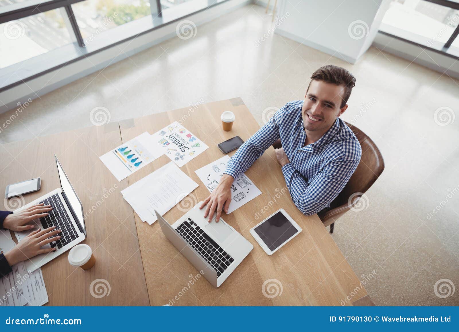 Overhead View of Smiling Executive Working at Desk Stock Photo - Image ...