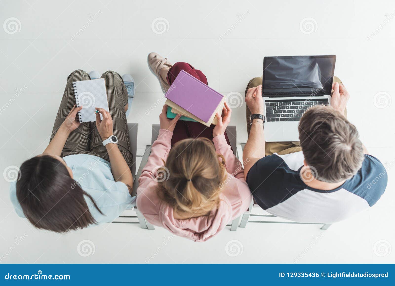 Overhead View of Students Studying with Notepad Books and Laptop Stock ...