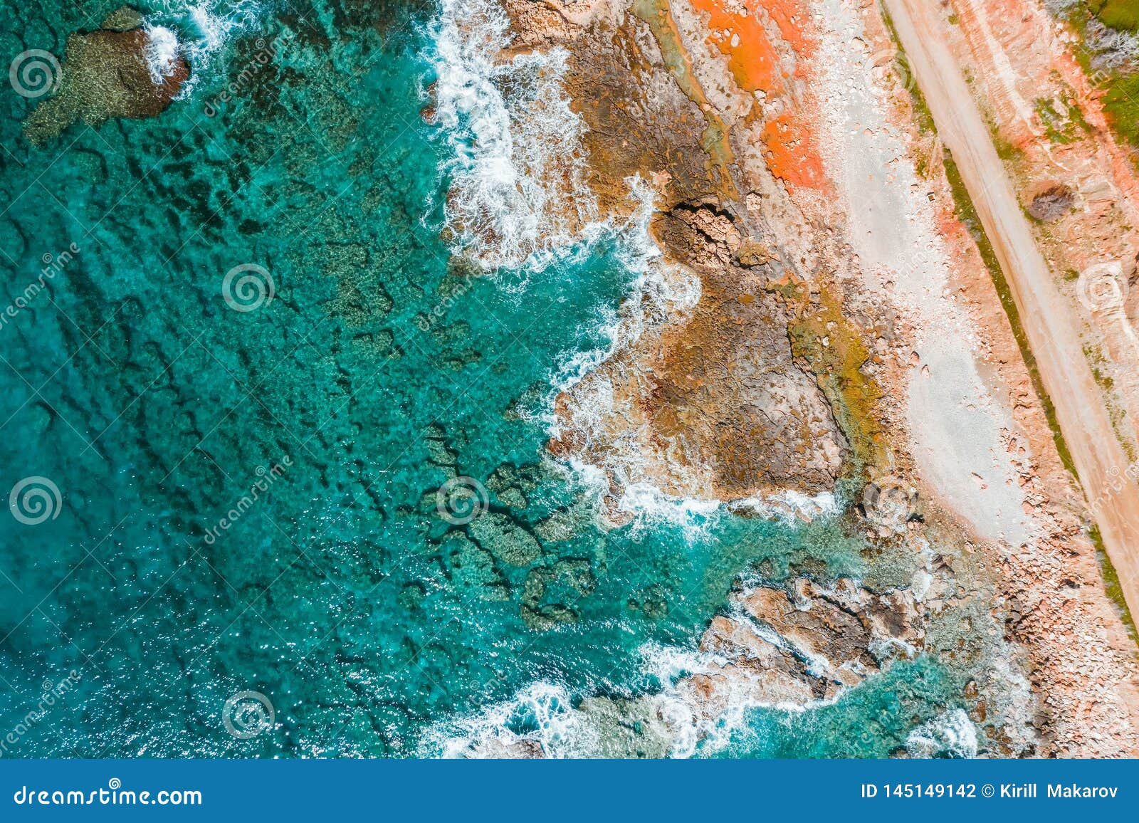Overhead View of Turquoise Sea, Waves and a Rocky Shoreline Stock Photo ...