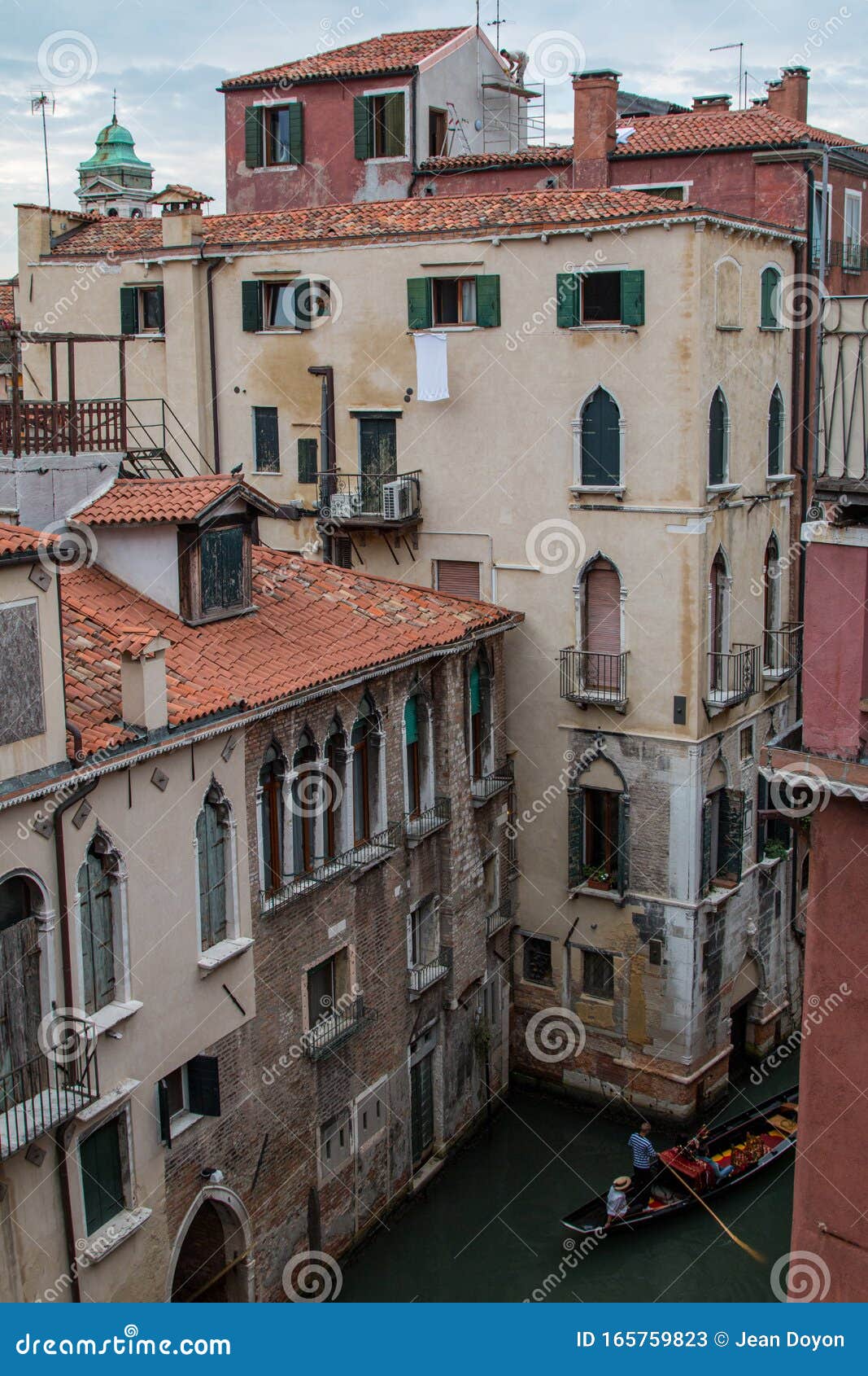 Overhead View of a Venice Canal with a Bell Tower on the Horizon ...