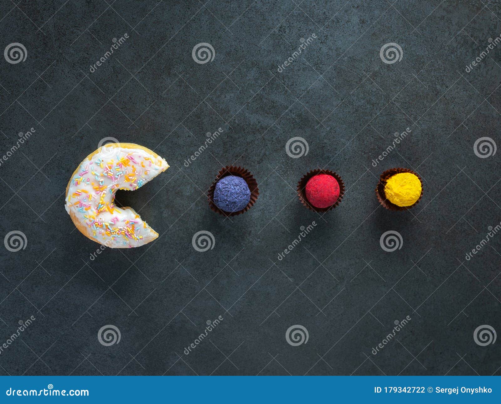 Overhead View of White Donut that Eat Colored Sweets Like in Pac Man ...