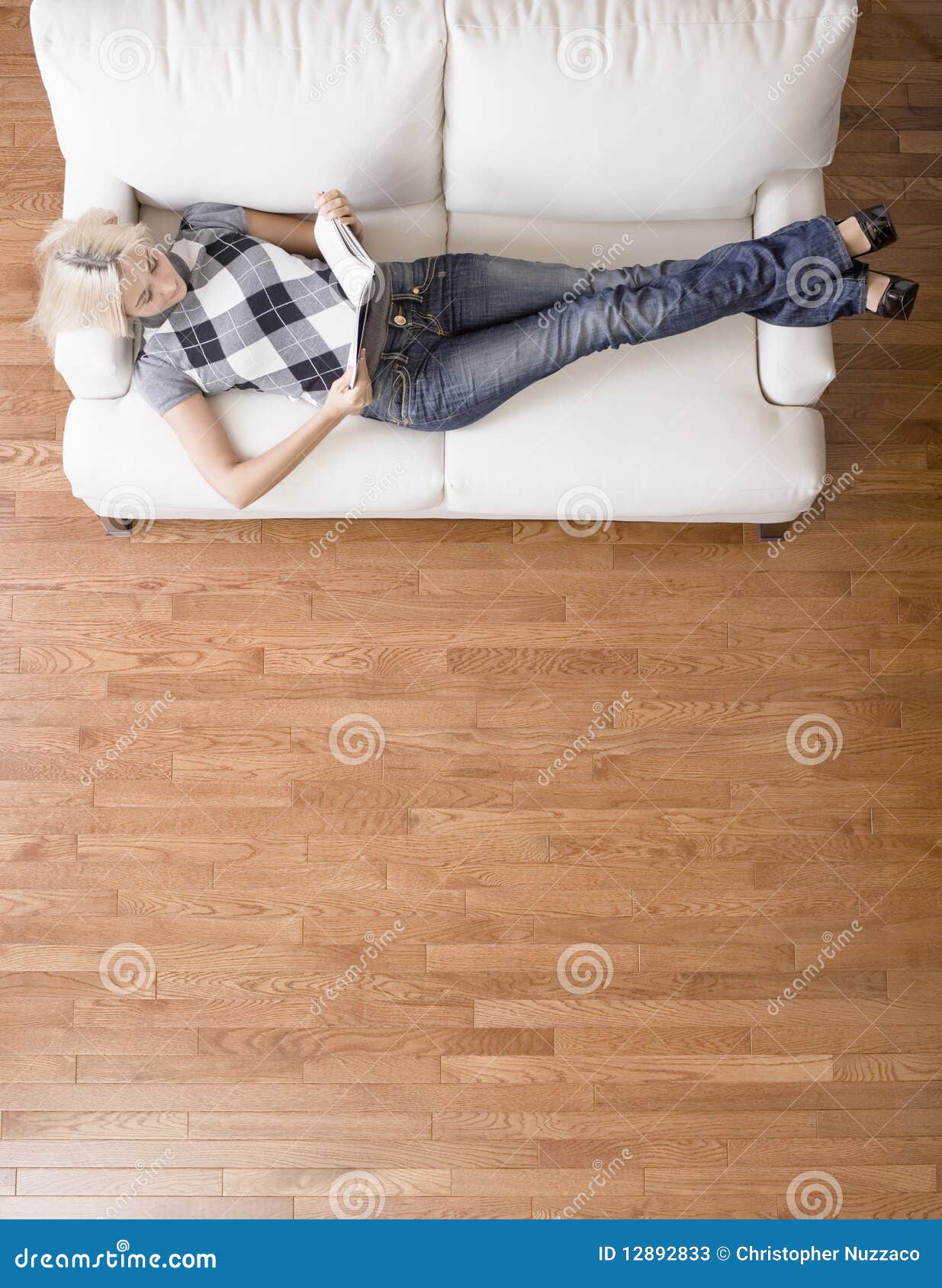 Overhead View of Woman Reading on Couch Stock Image - Image of ...