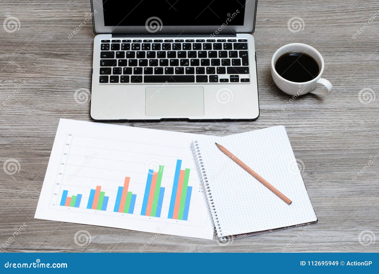 Overhead View on the Wooden Table Laptop, Notebook, Pencil, Graphics on ...