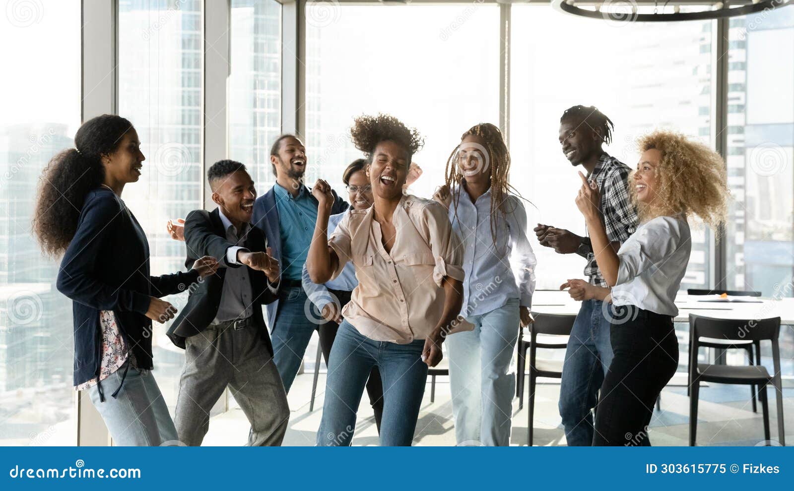 Overjoyed Group of Multicultural Students Employees Dancing in Modern ...