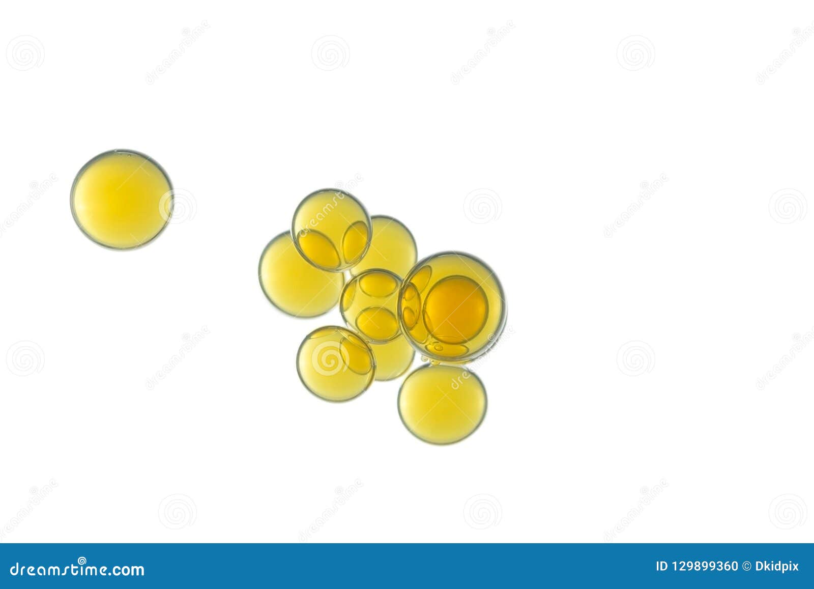 Overlapping yellow bubbles stock photo. Image of essential - 129899360