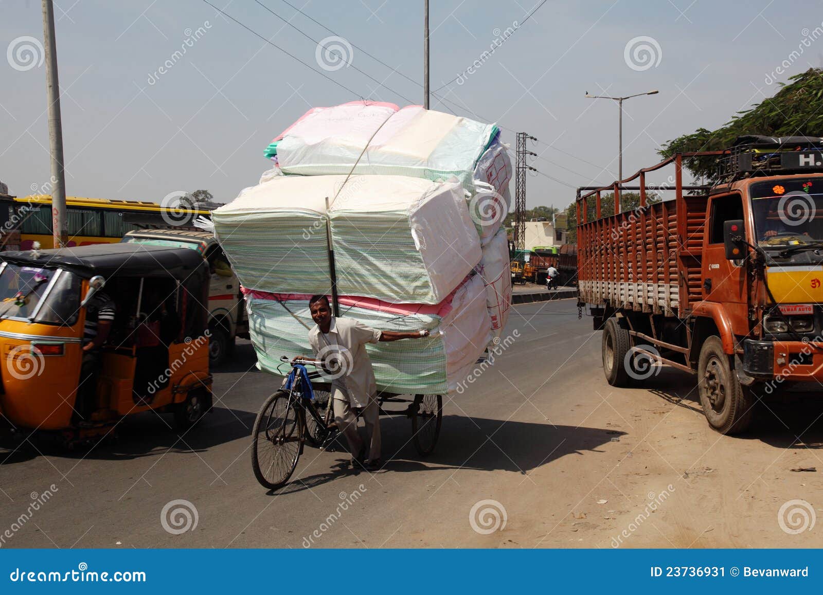 Overloaded bicycle, India editorial photo. Image of effort - 23736931