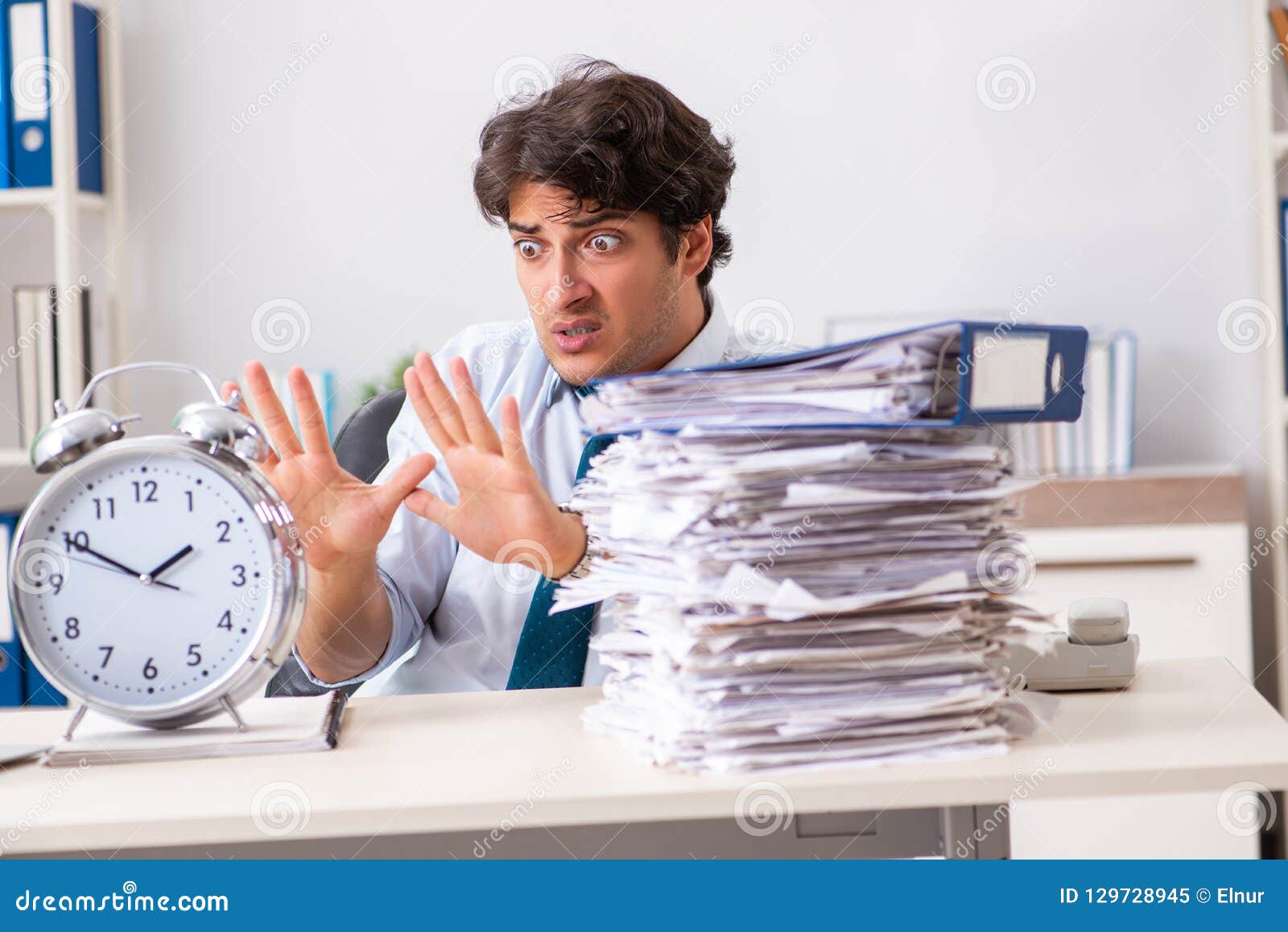 The Overloaded Busy Employee with Too Much Work and Paperwork Stock ...