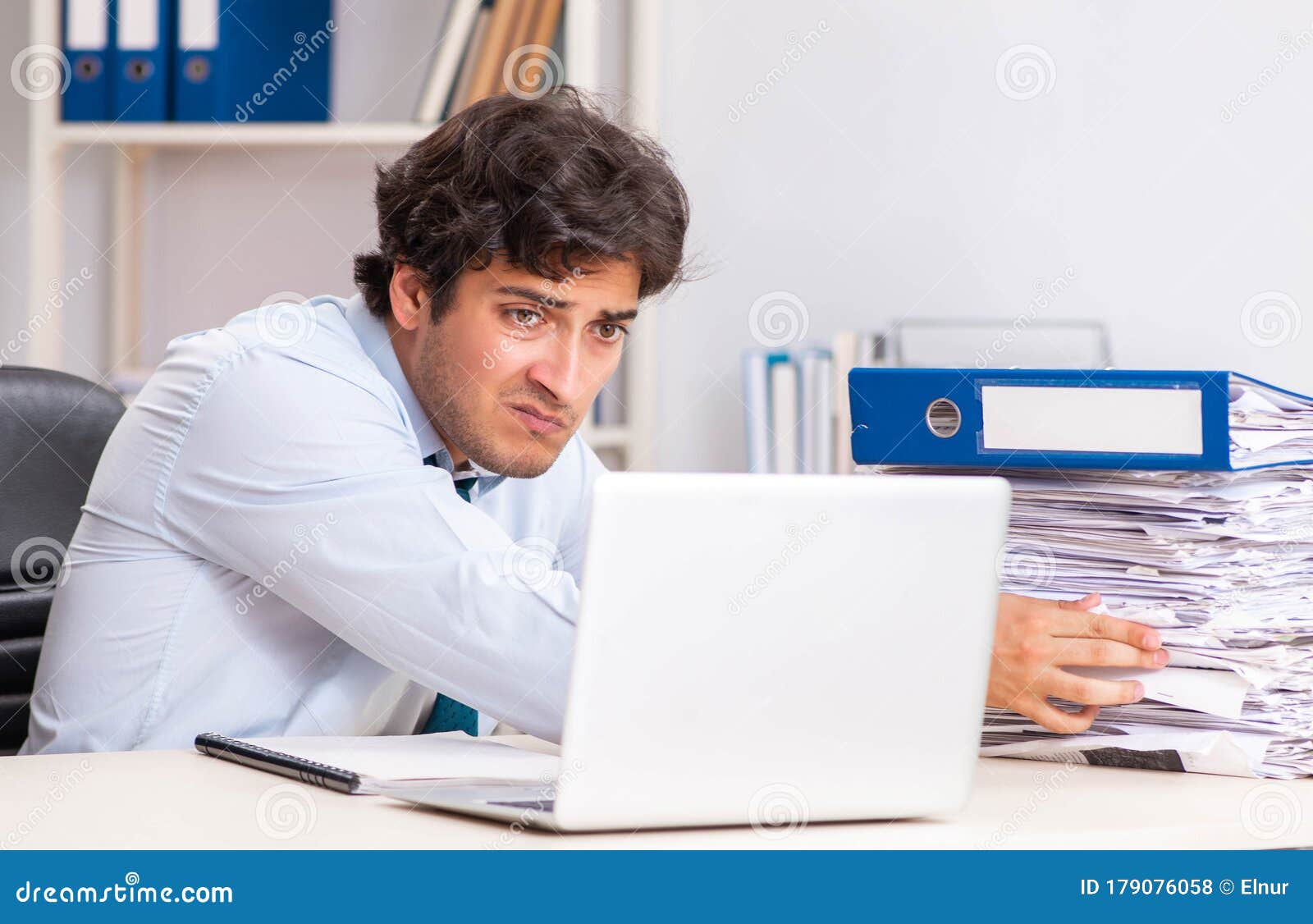 Overloaded Busy Employee with Too Much Work and Paperwork Stock Photo ...