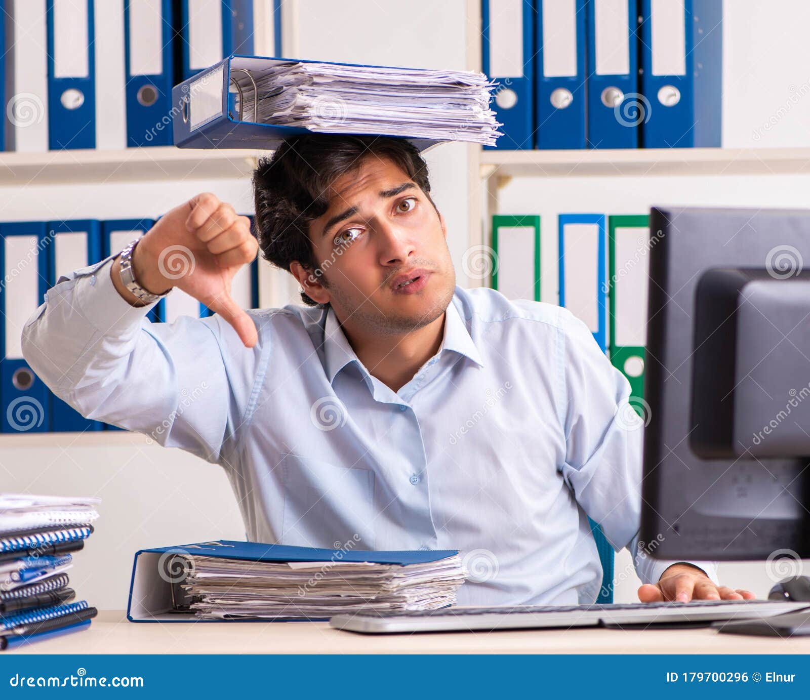 Overloaded Busy Employee with Too Much Work and Paperwork Stock Photo ...