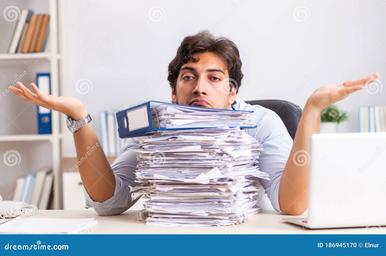 Overloaded Busy Employee with Too Much Work and Paperwork Stock Photo ...