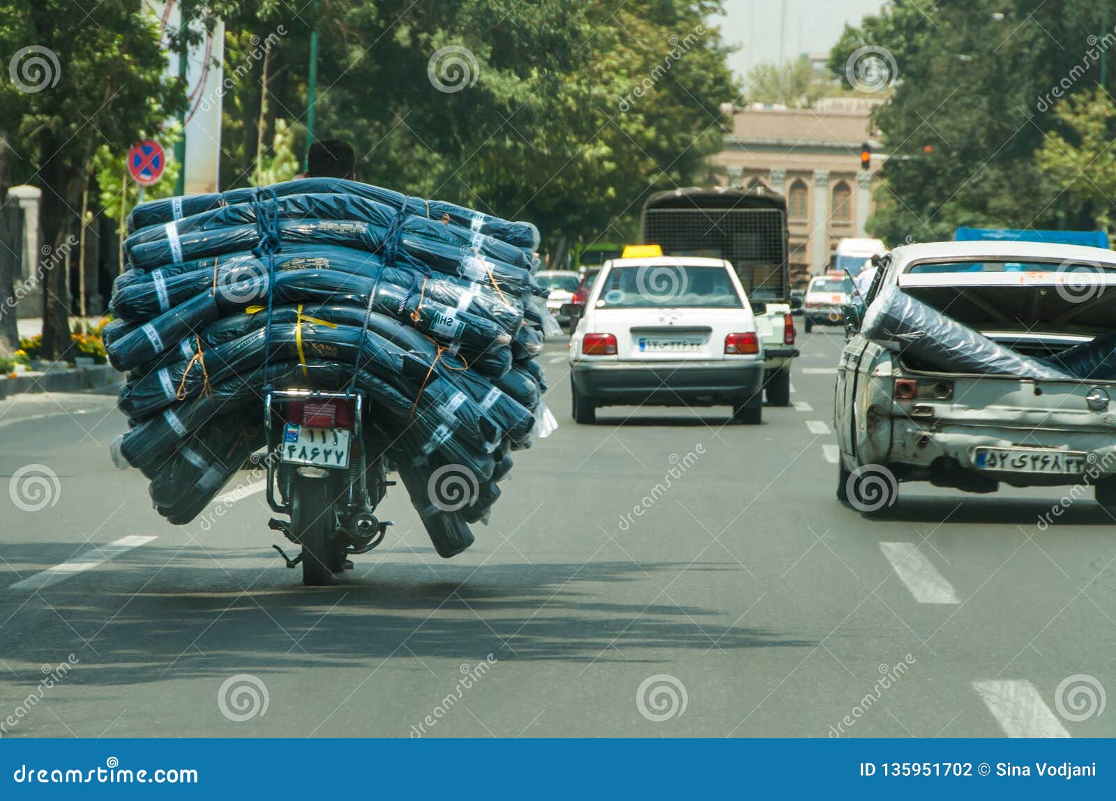 Overloaded motorbike editorial photography. Image of drive - 135951702