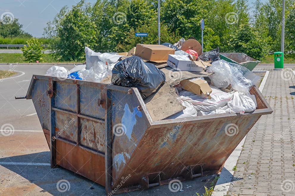 Overloaded Skip Trash stock image. Image of large, strike - 256734575