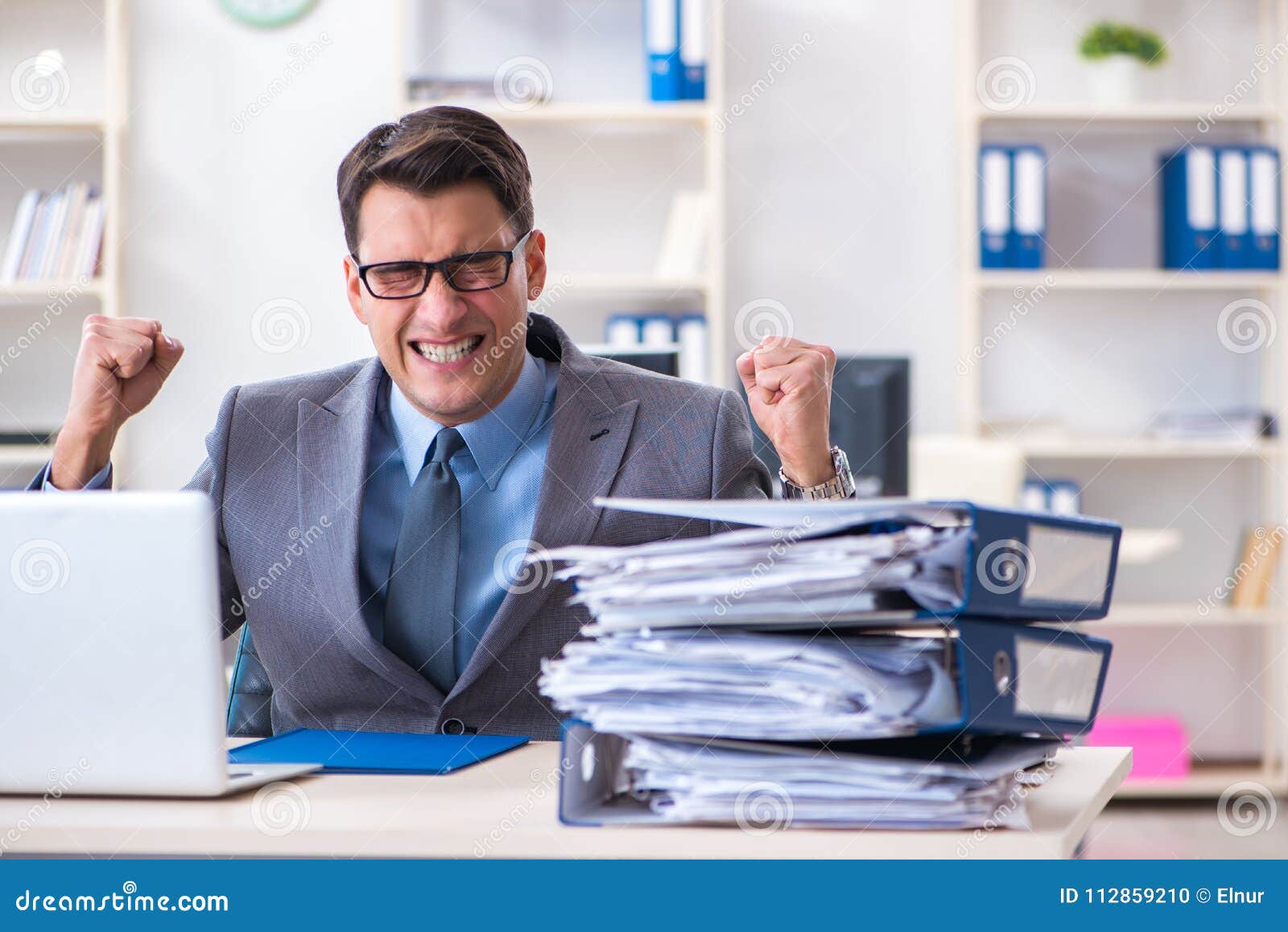 The Overloaded with Work Employee Under Paperwork Burden Stock Photo ...
