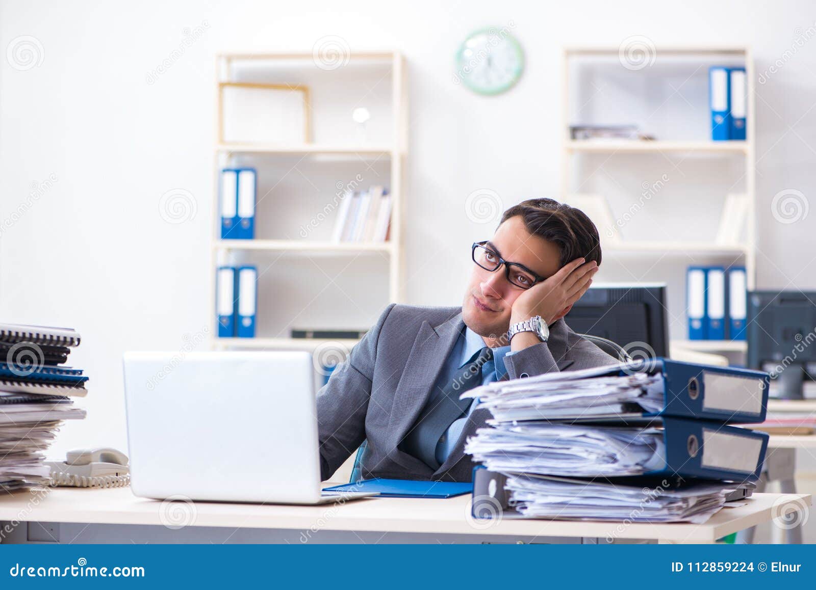The Overloaded with Work Employee Under Paperwork Burden Stock Photo ...