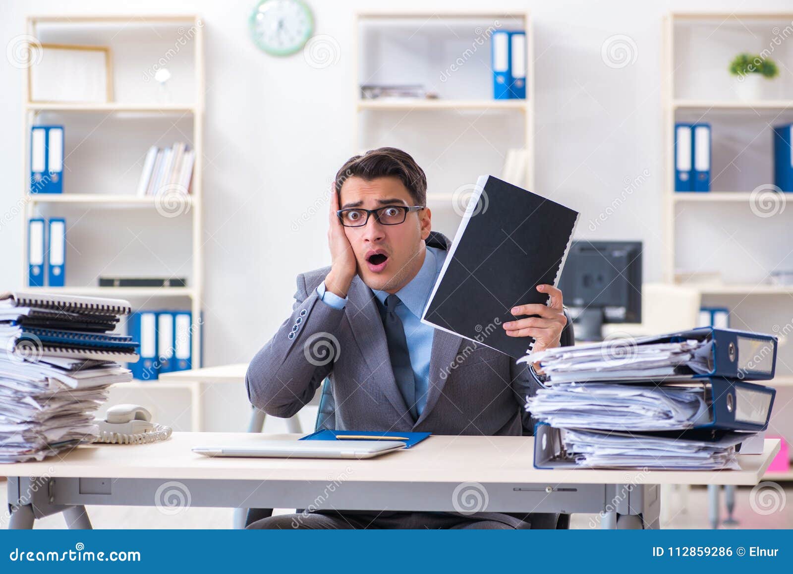 The Overloaded with Work Employee Under Paperwork Burden Stock Photo ...