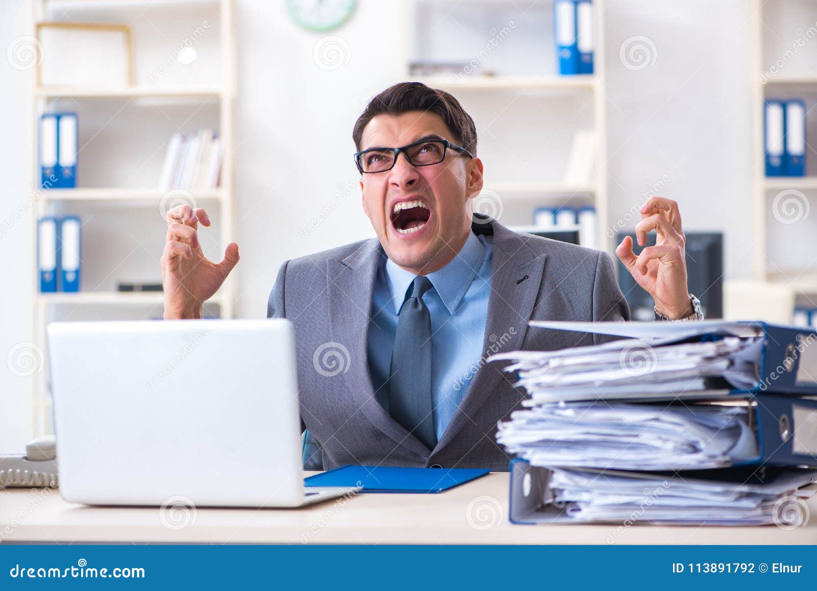 The Overloaded with Work Employee Under Paperwork Burden Stock Photo ...