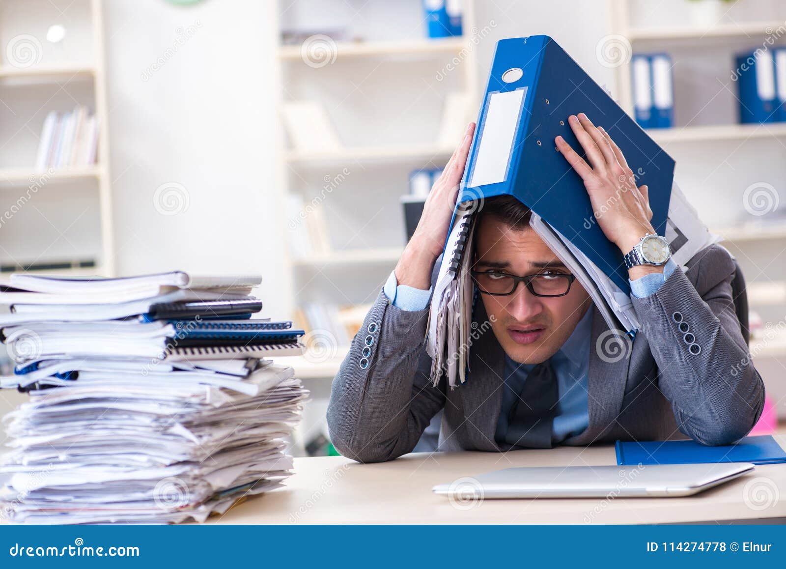The Overloaded with Work Employee Under Paperwork Burden Stock Photo ...