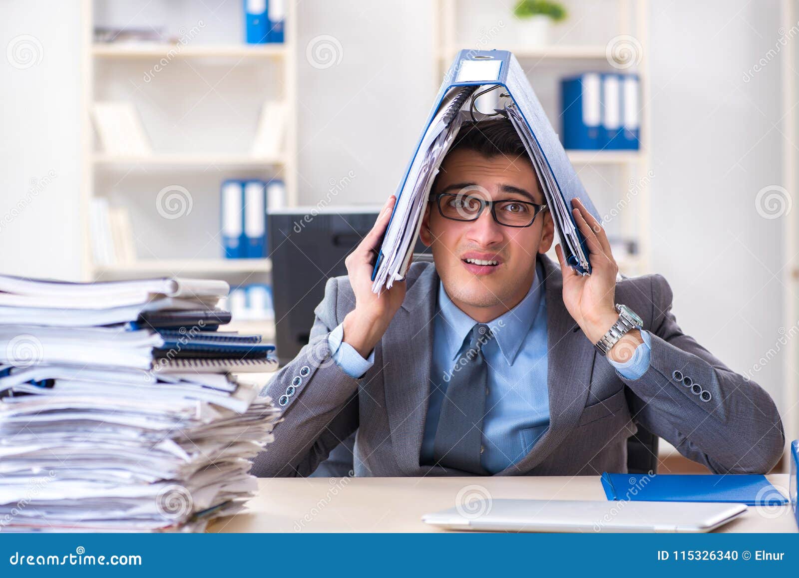 The Overloaded with Work Employee Under Paperwork Burden Stock Photo ...