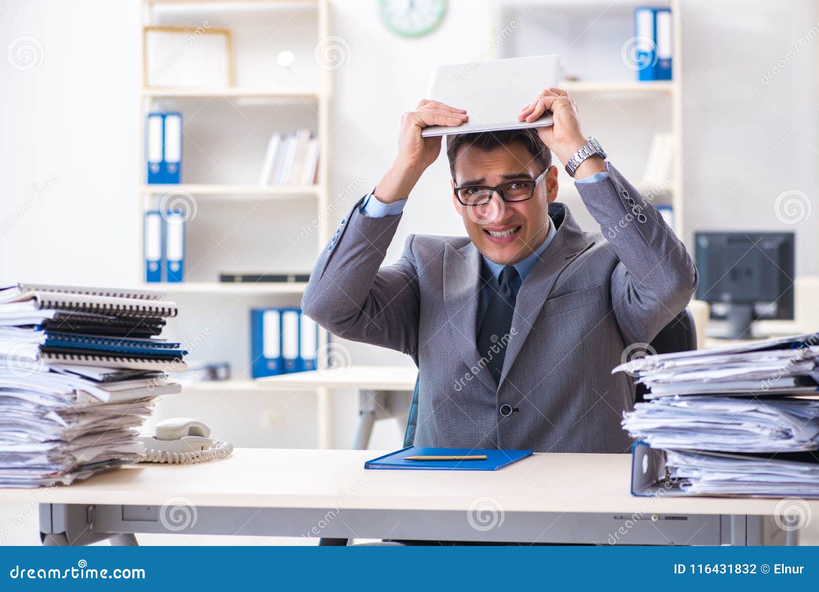 The Overloaded with Work Employee Under Paperwork Burden Stock Photo ...